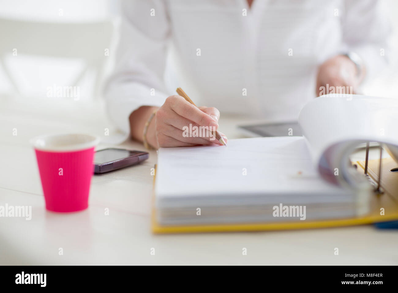 Woman filling documents Stock Photo - Alamy