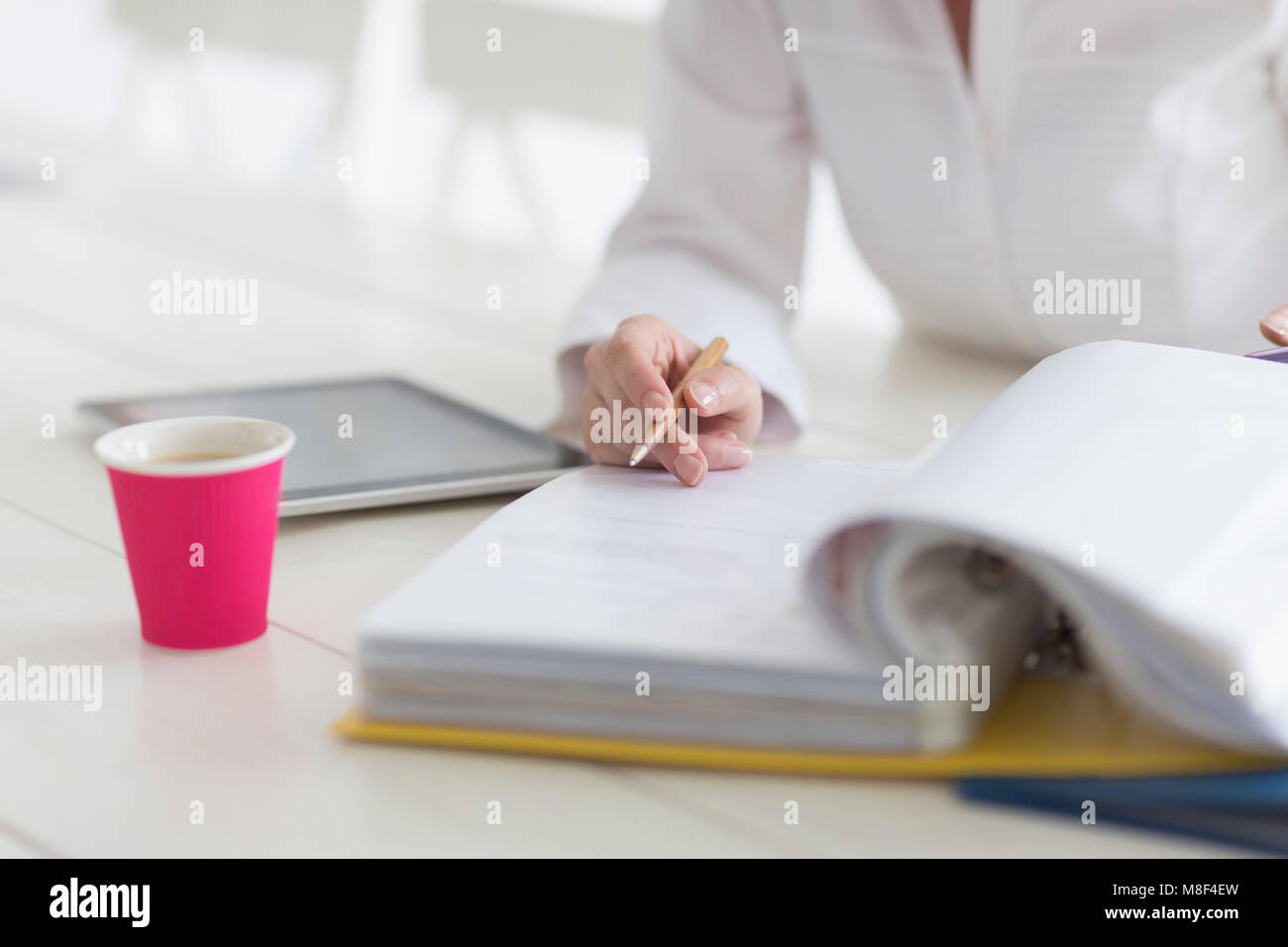 Woman filling documents Stock Photo - Alamy