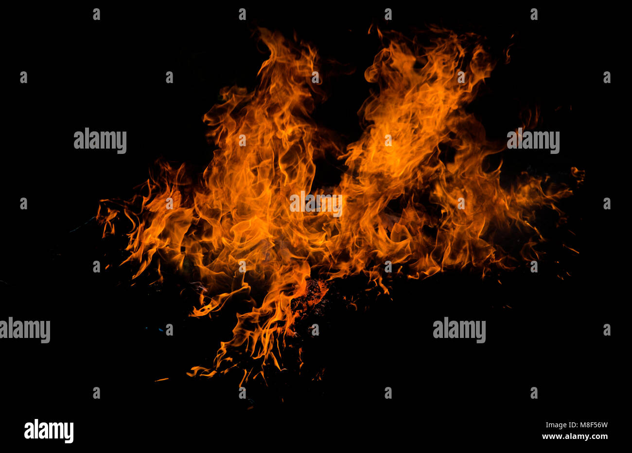 fire flame on black background. fire from burning paper and plastic ...