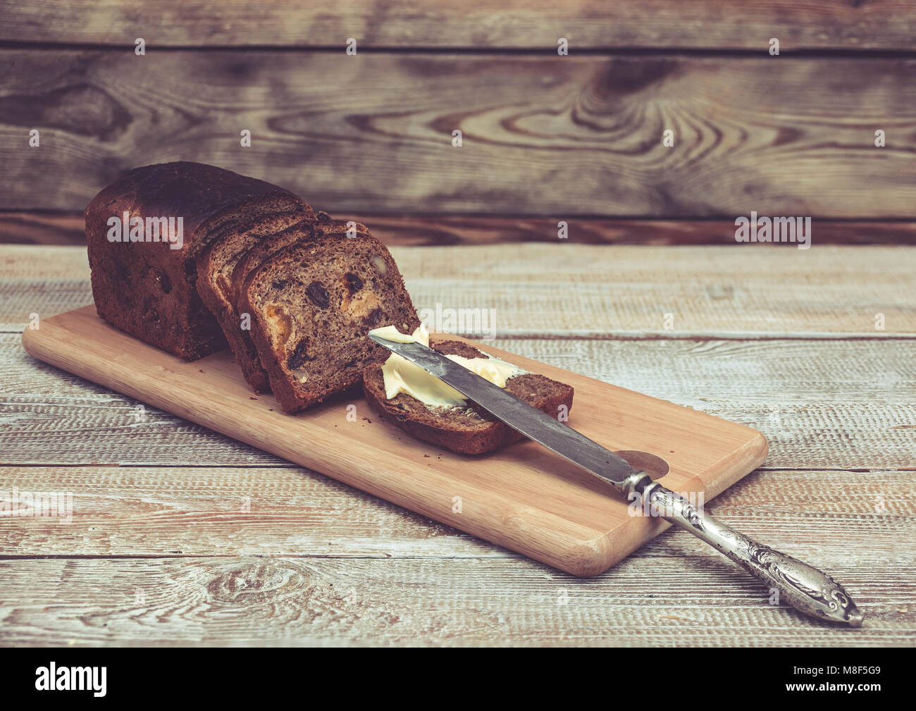 Dark rye bread with dried apricots and raisin. Healthy bread. Slices ...