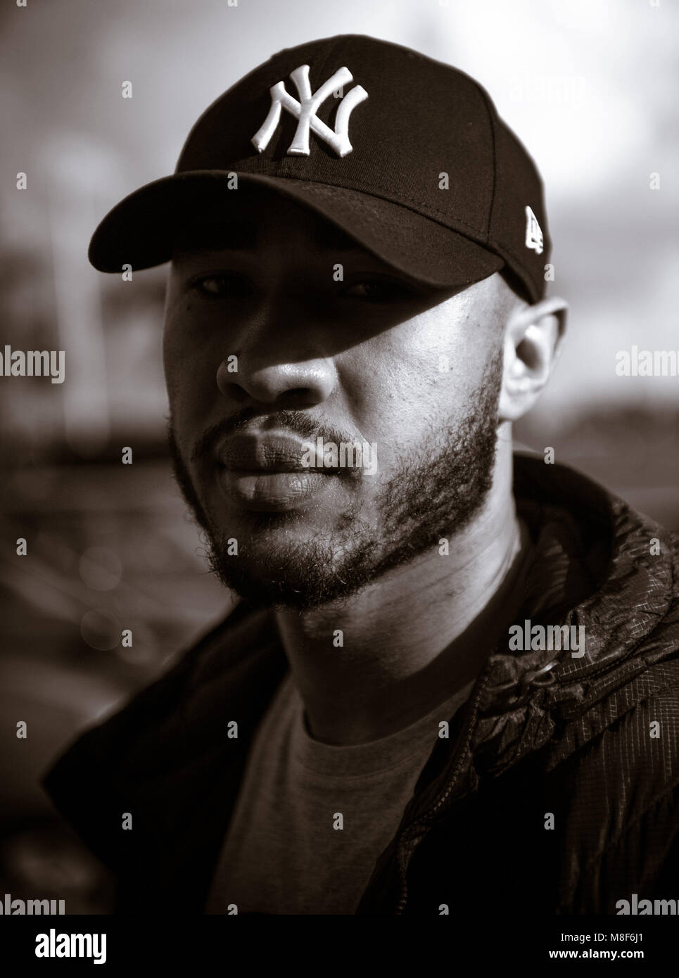 Black man posing for portrait Stock Photo - Alamy