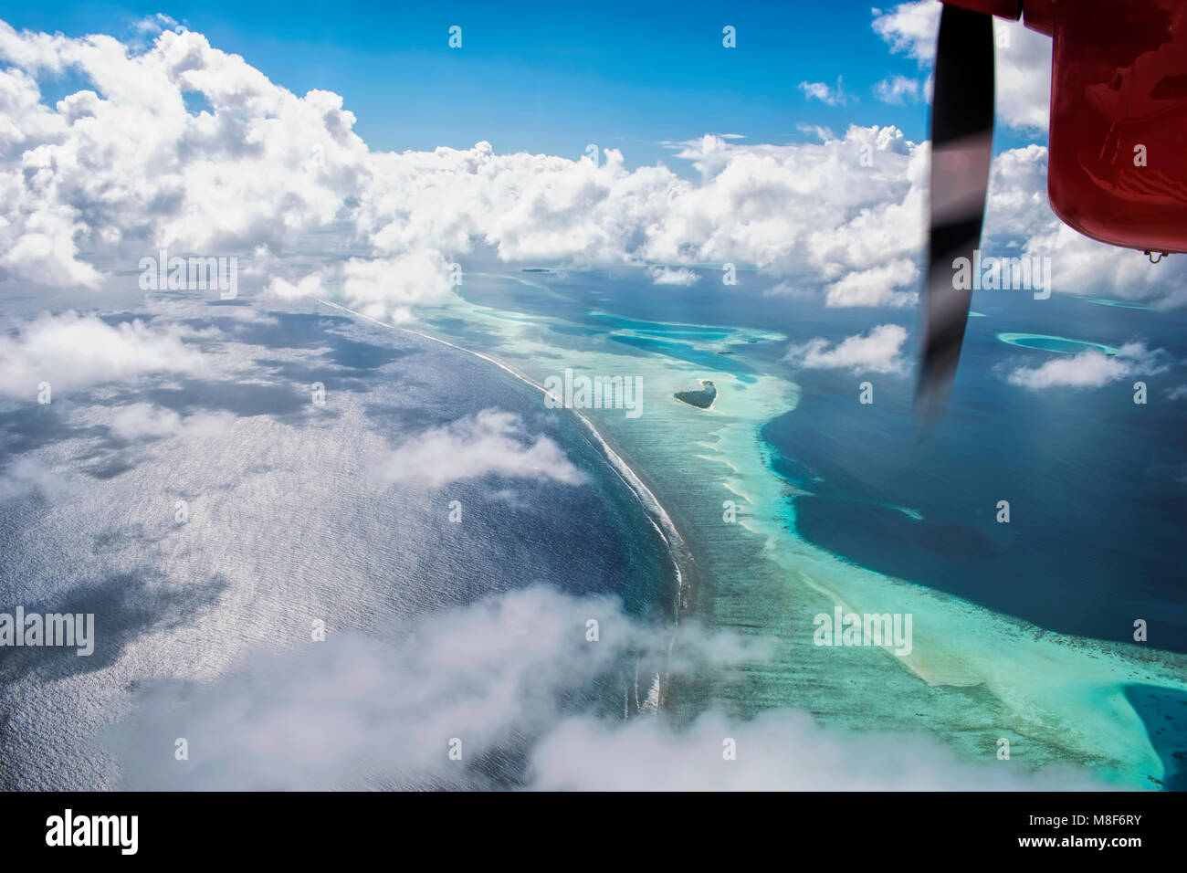 Aerial view from a Seaplane flying over beautiful tropical Maldive ...