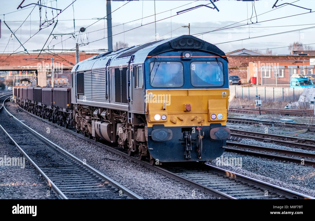 A diesel locomotive pulling some wagons Stock Photo - Alamy