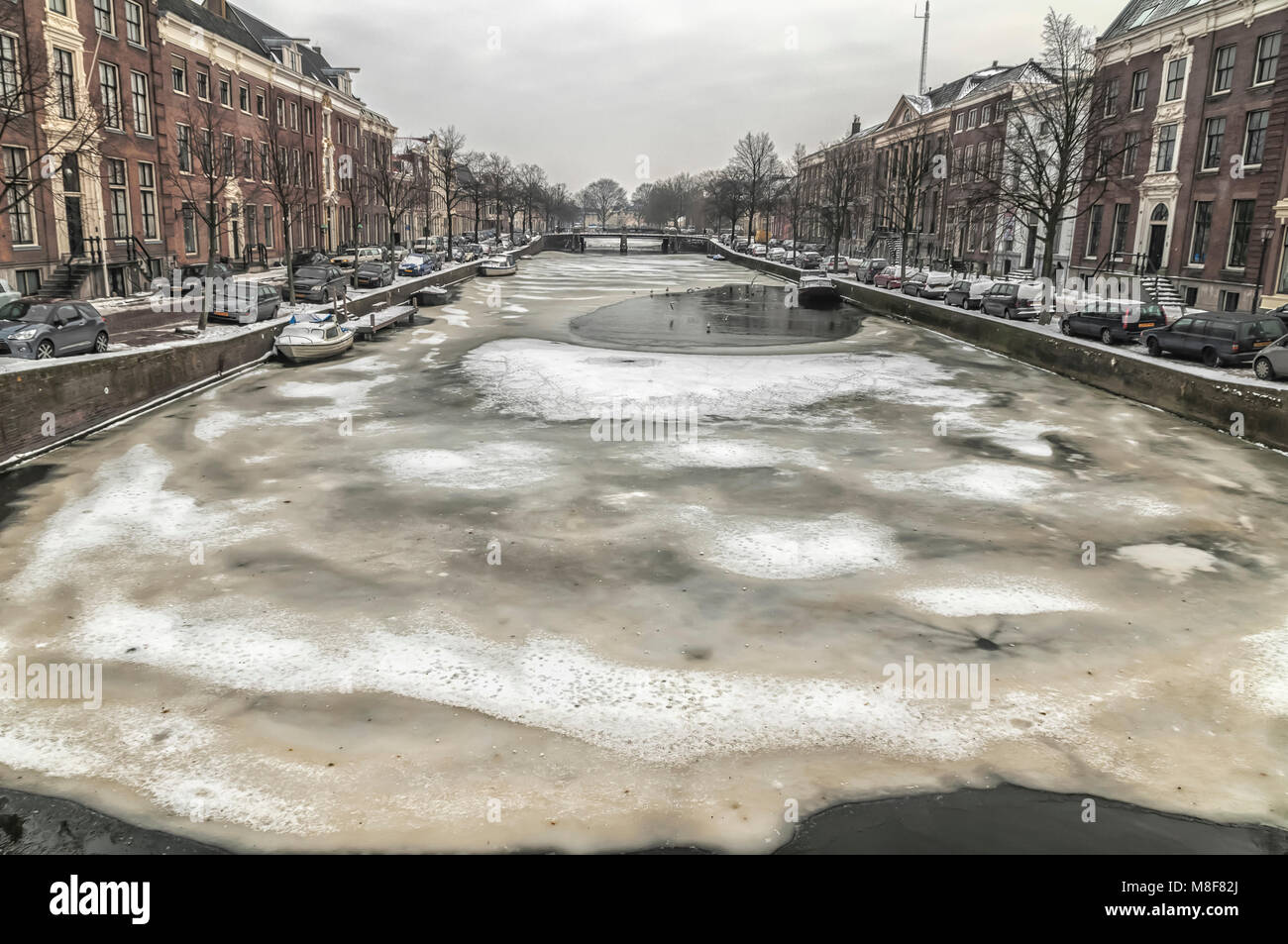 Dutch canal frozen and covered with snow Stock Photo - Alamy