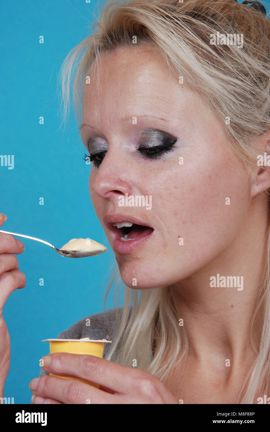 young woman eatin cream Stock Photo - Alamy