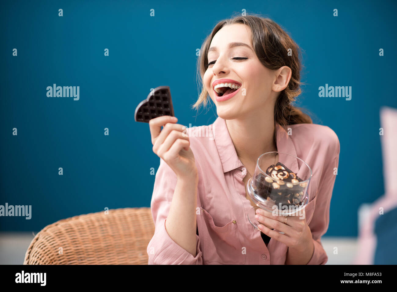 Girl eating dark chocolate hi-res stock photography and images - Alamy