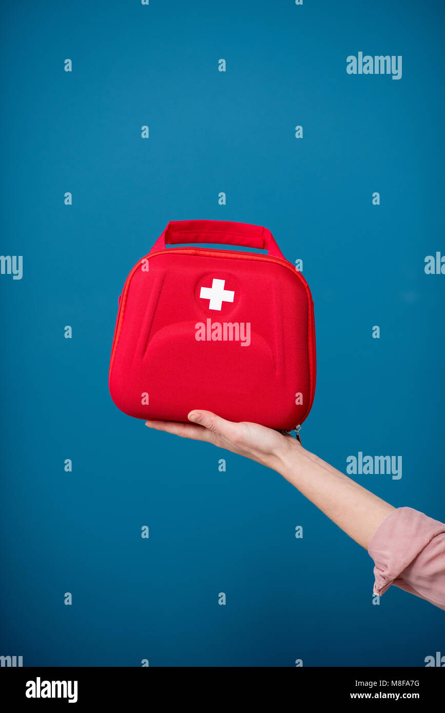 First aid kit on the blue background Stock Photo - Alamy