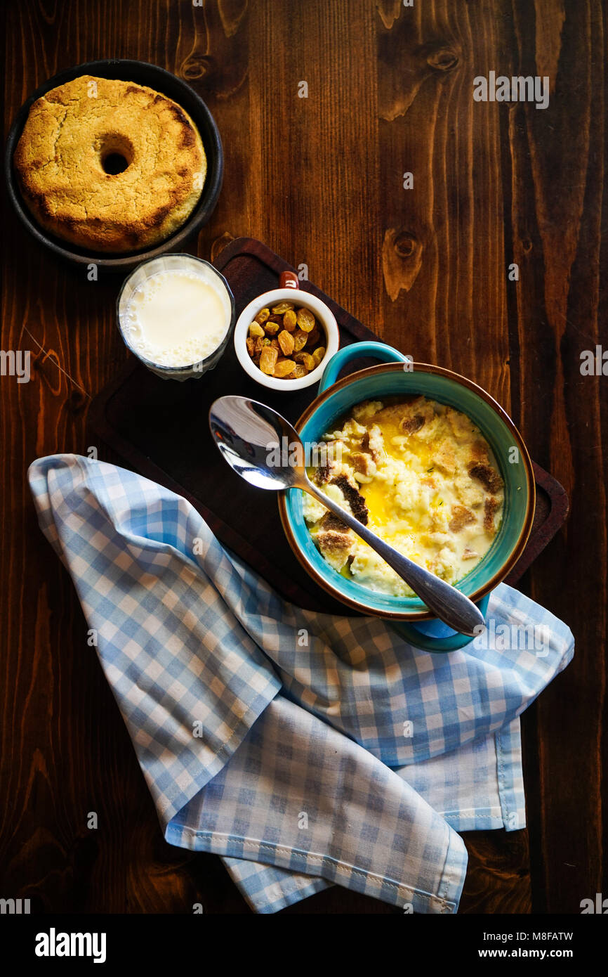 Rustic georgian breakfast set with healthy corn and milk porridge on ...