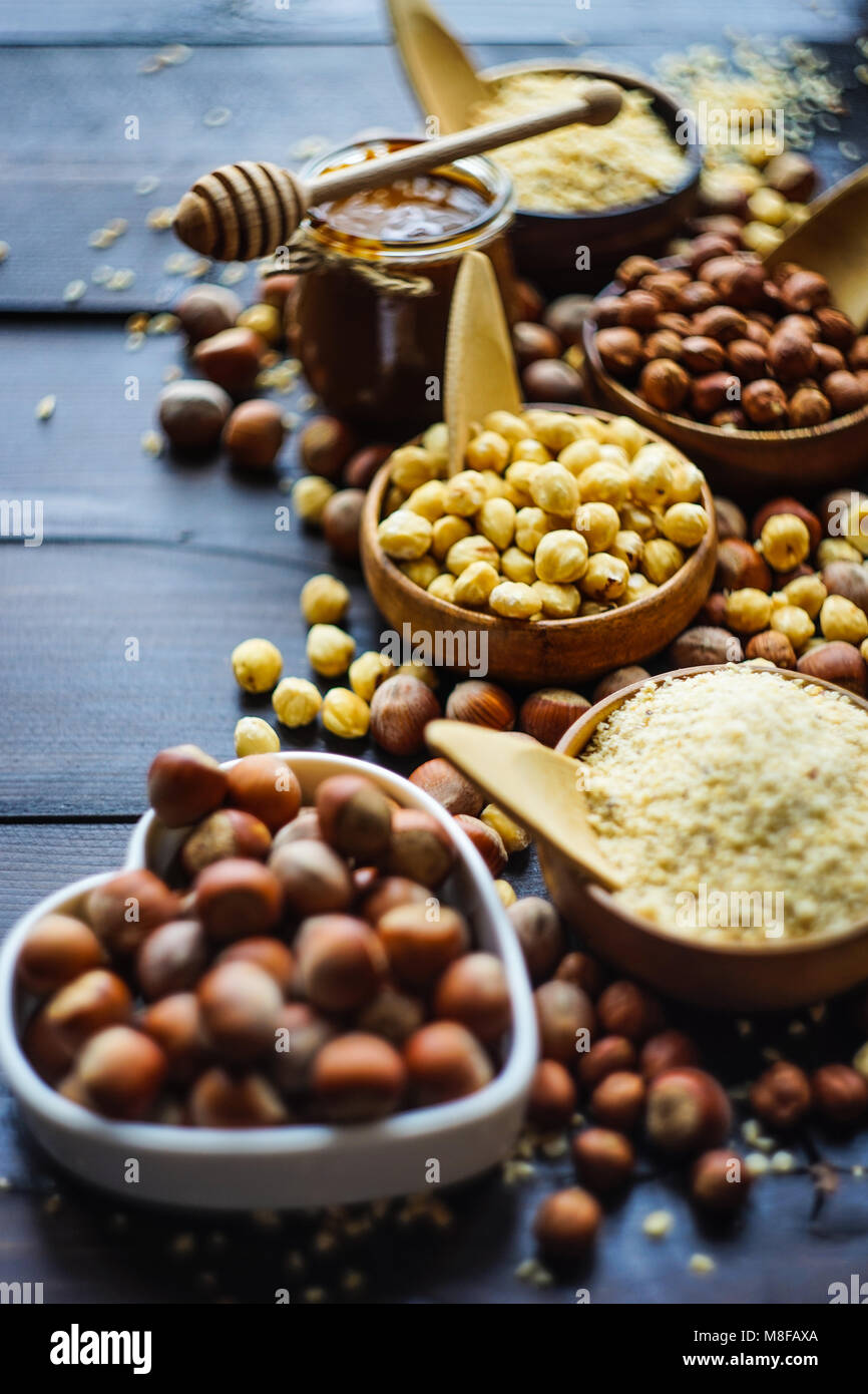 Different types of hazelnuts on dark wooden background with copyspace ...