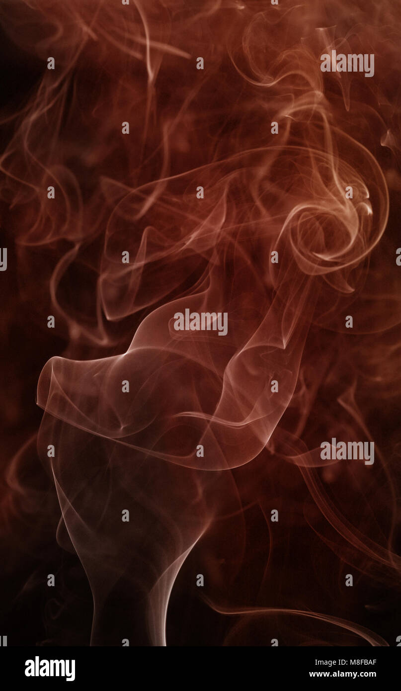 Smoke trails above burning incense. Intended as an abstract to ...