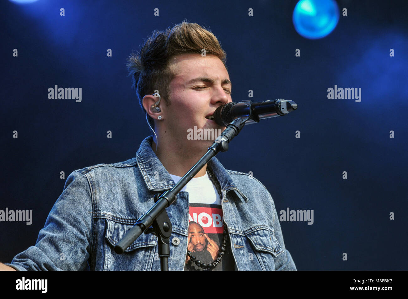 Pop star performing celebrity music on stage singing microphone hi-res ...