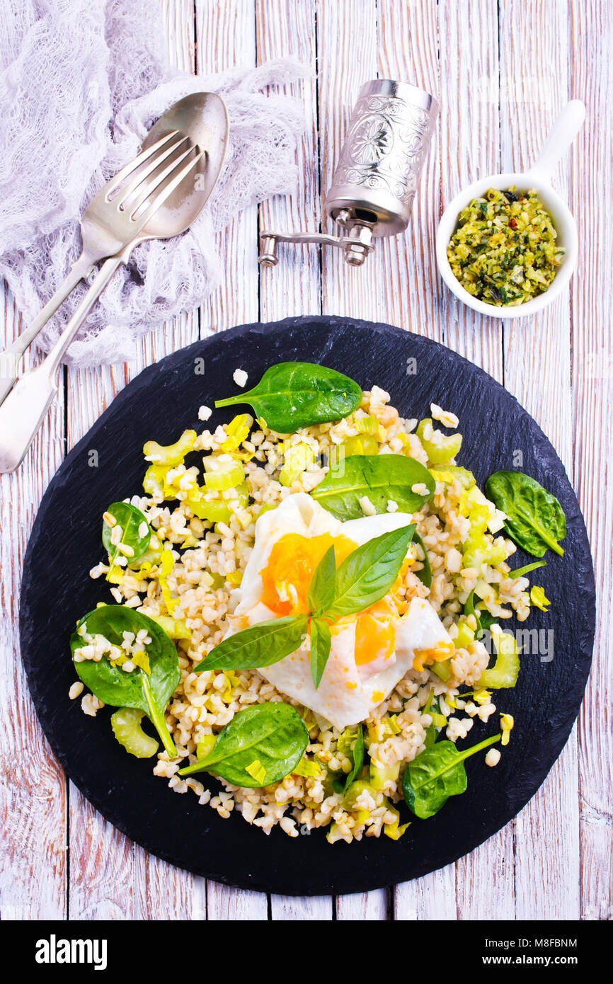 fried bulgur with basil and fried chicken egg Stock Photo - Alamy