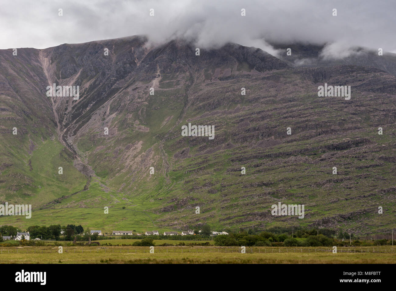 Annat, Scotland - June 10, 2012: Massive brown-green mountain wall with ...