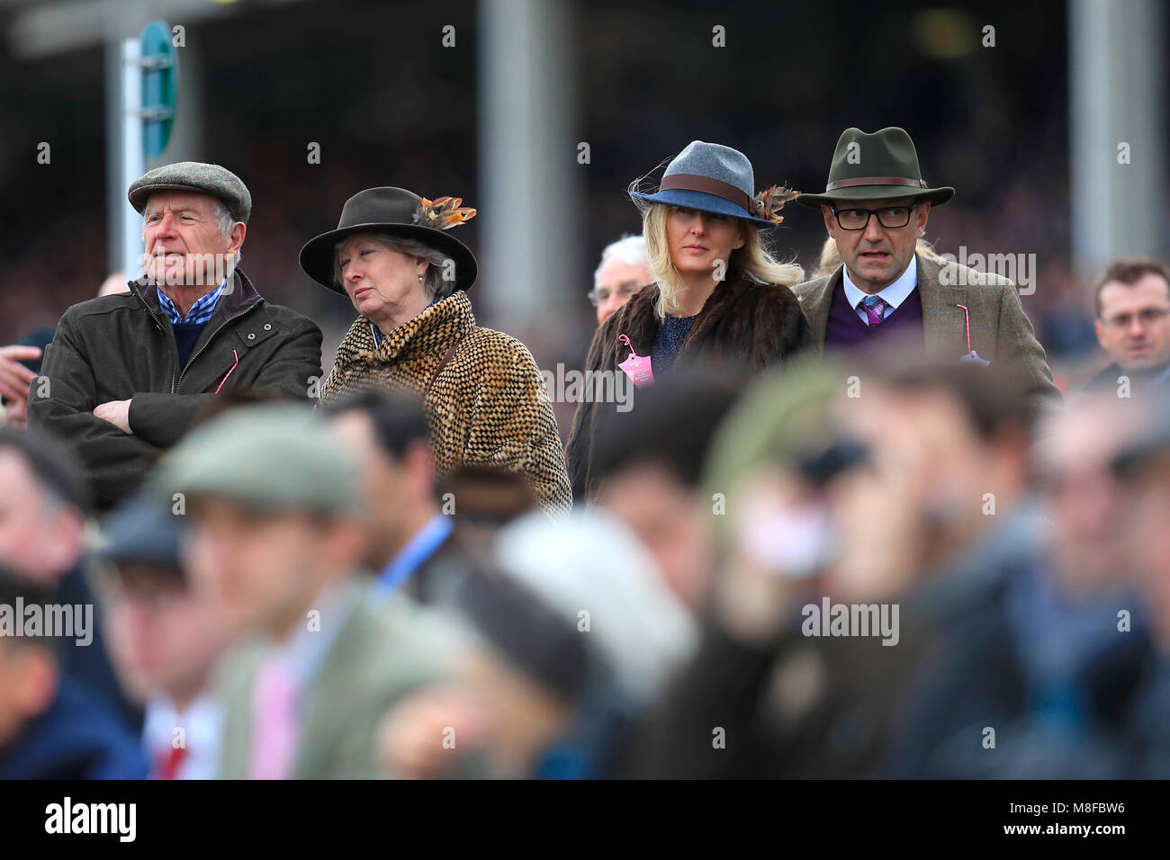 Racegoers watch the action during Ladies Day of the 2018 Cheltenham ...