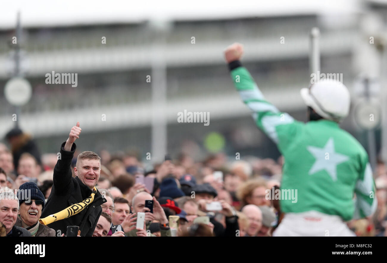 A racegoer salutes jockey davy russell on presenting percy hi-res stock ...