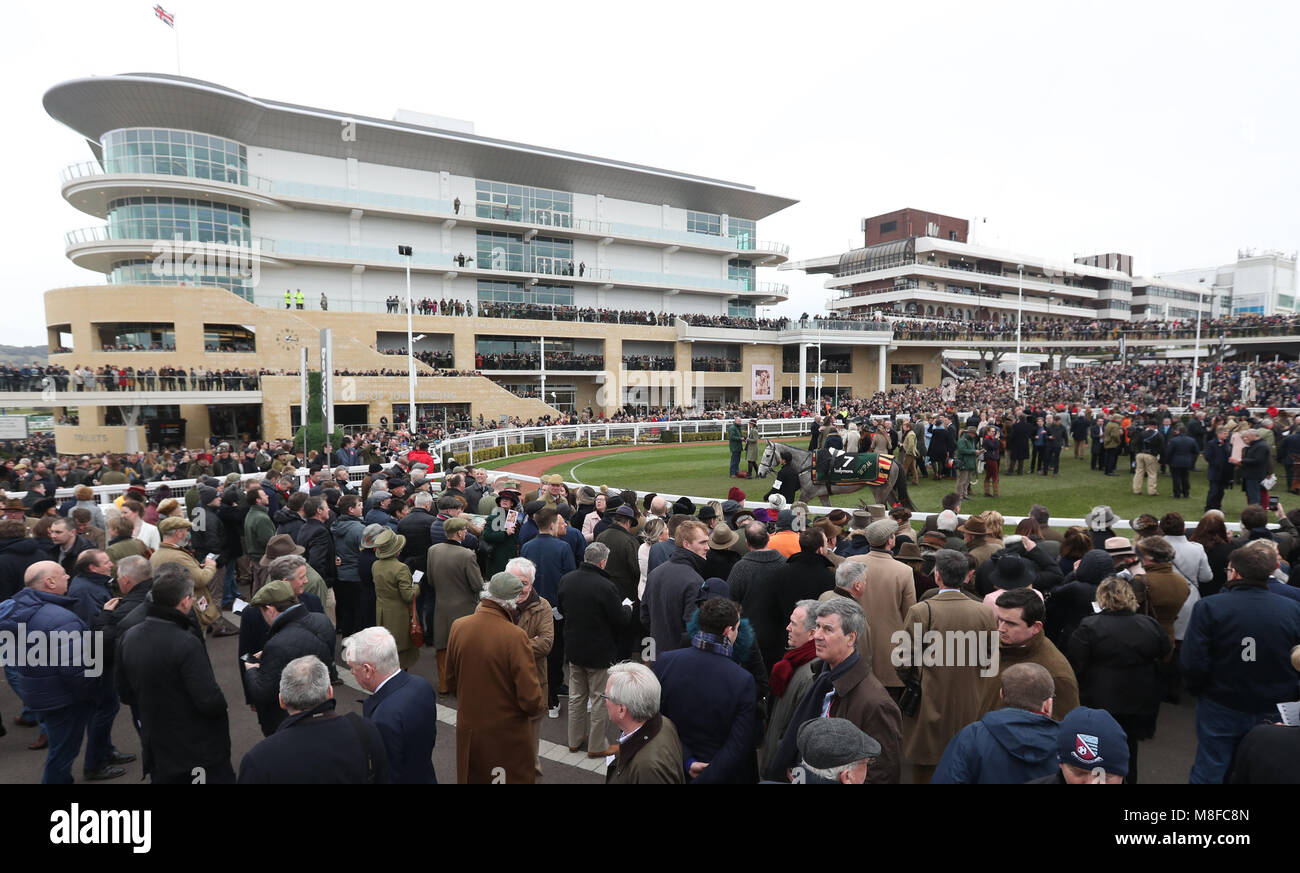 Racegoers gather as horses circle the parade ring before the Ballymore ...