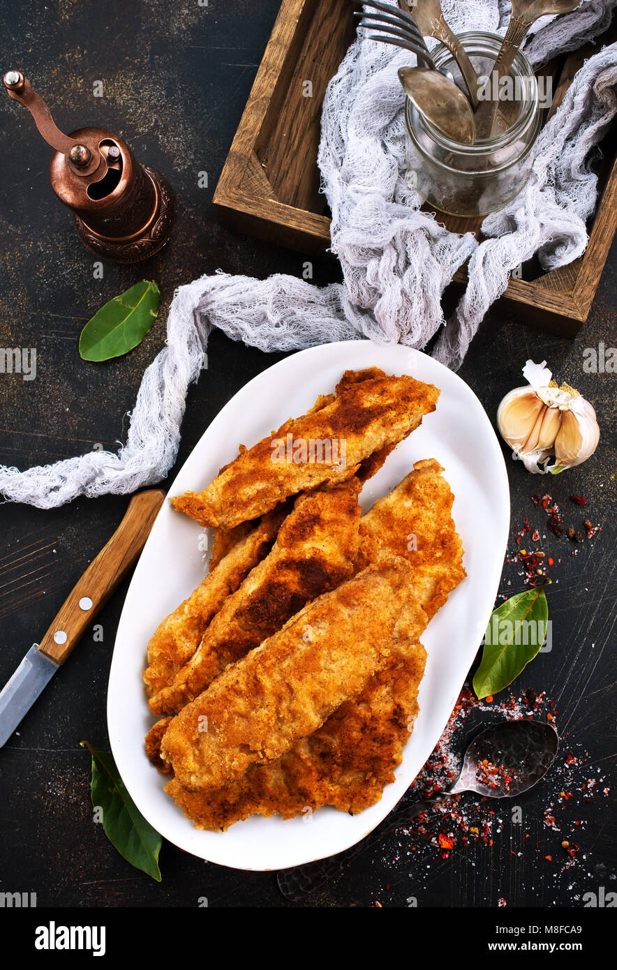 fried fish fillets on white plate, fried fish Stock Photo - Alamy