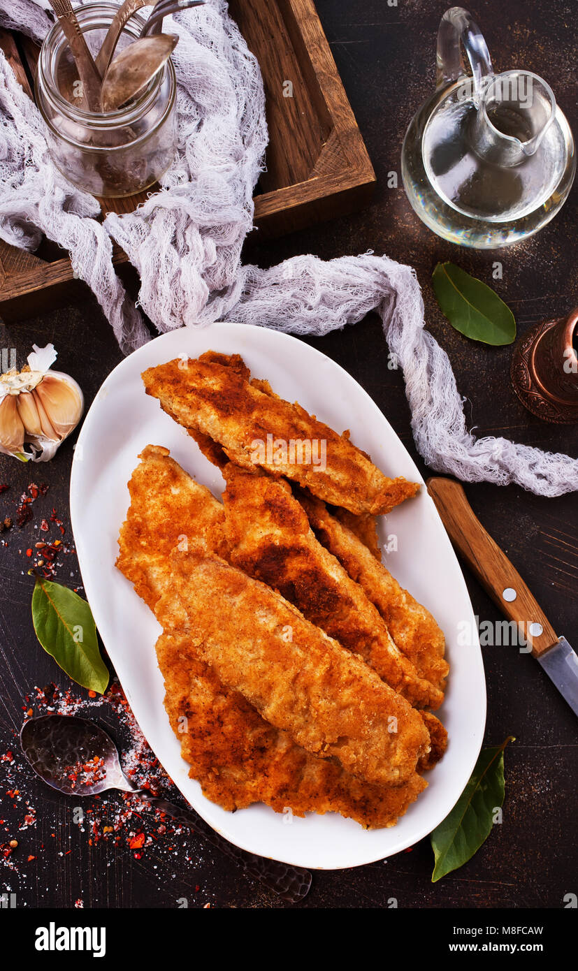 fried fish fillets on white plate, fried fish Stock Photo - Alamy