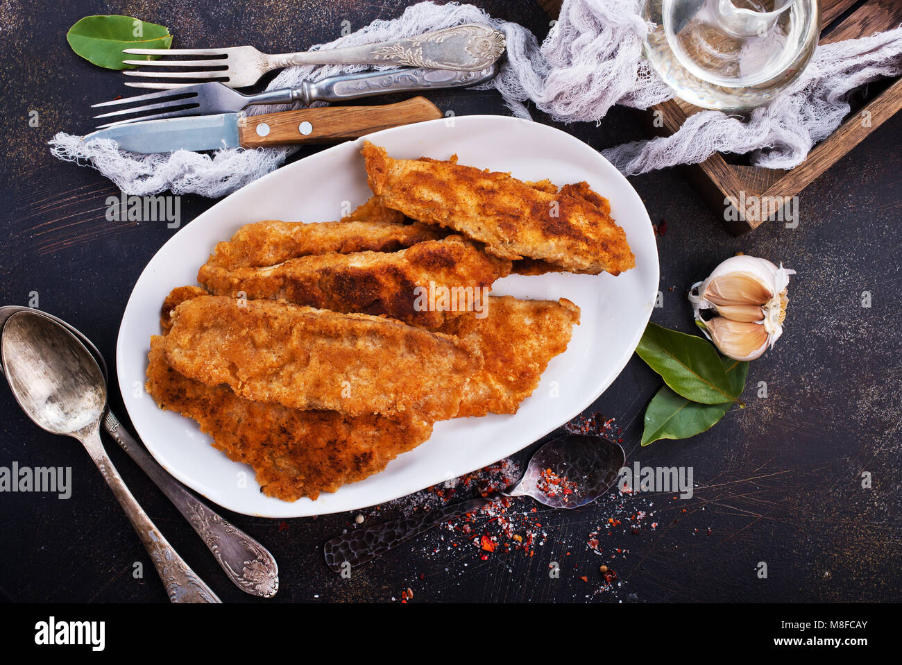 fried fish fillets on white plate, fried fish Stock Photo - Alamy