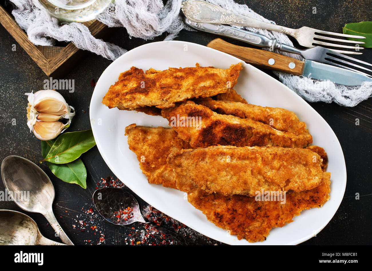 fried fish fillets on white plate, fried fish Stock Photo - Alamy