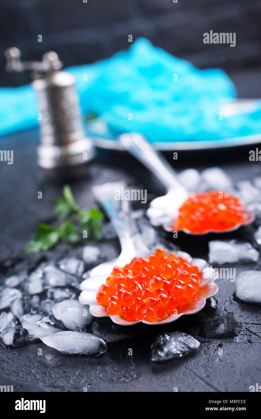 red salmon caviar, salmon caviar in metal spoons Stock Photo - Alamy