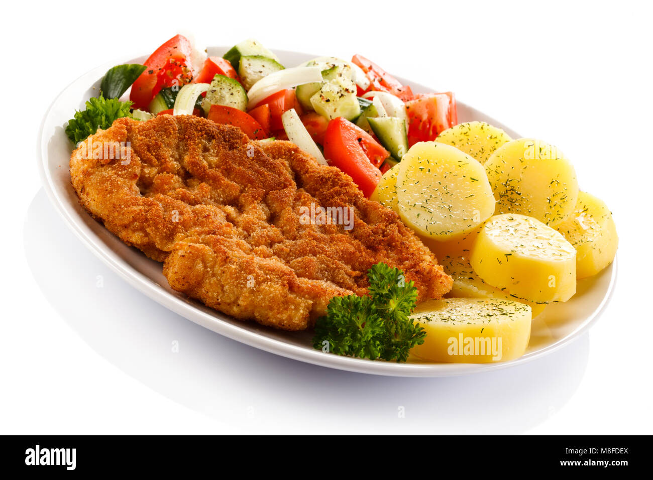 Fried pork meat potatoes Cut Out Stock Images & Pictures - Alamy