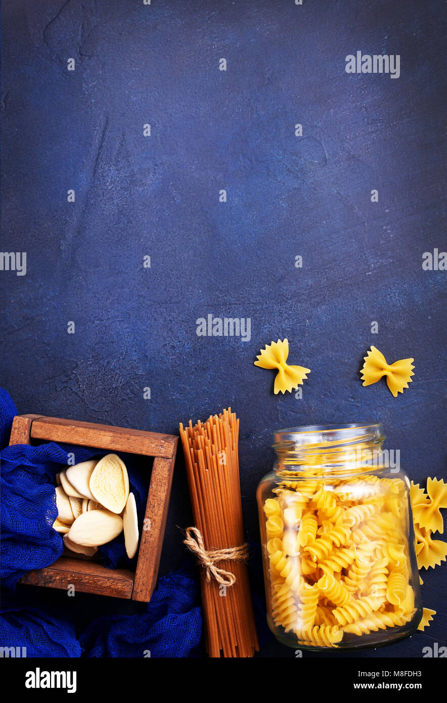 different kind of pasta, raw pasta on a table Stock Photo - Alamy