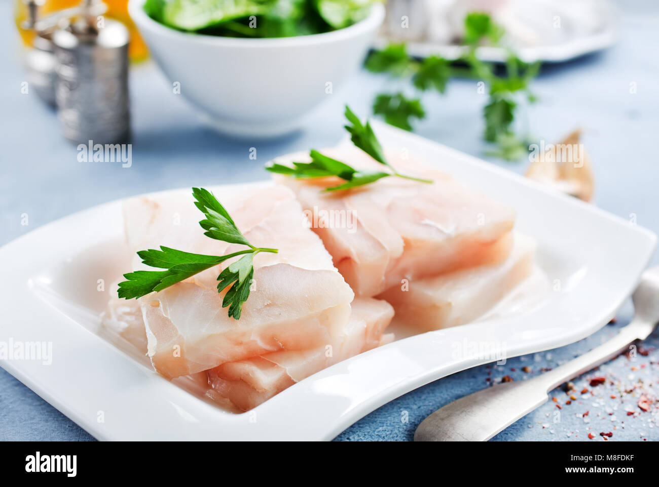 raw fish fillet with salt and spice, white fish Stock Photo - Alamy
