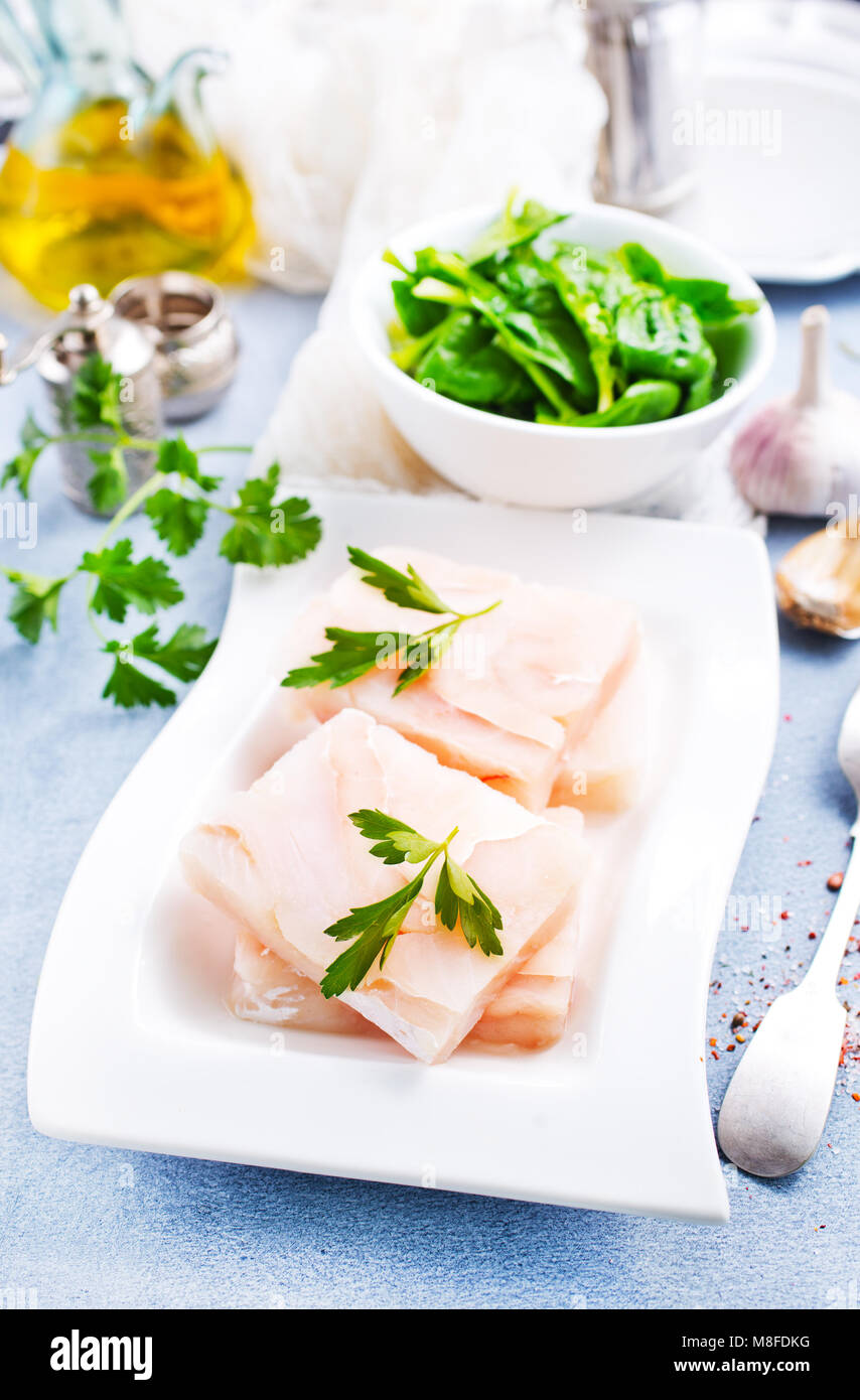 raw fish fillet with salt and spice, white fish Stock Photo - Alamy