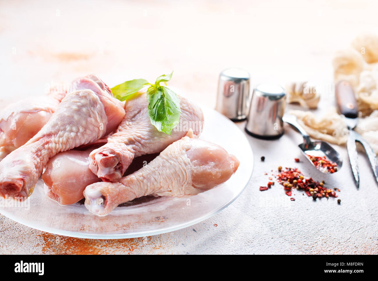 raw chicken legs with spice and salt, chicken legs on plate Stock Photo ...