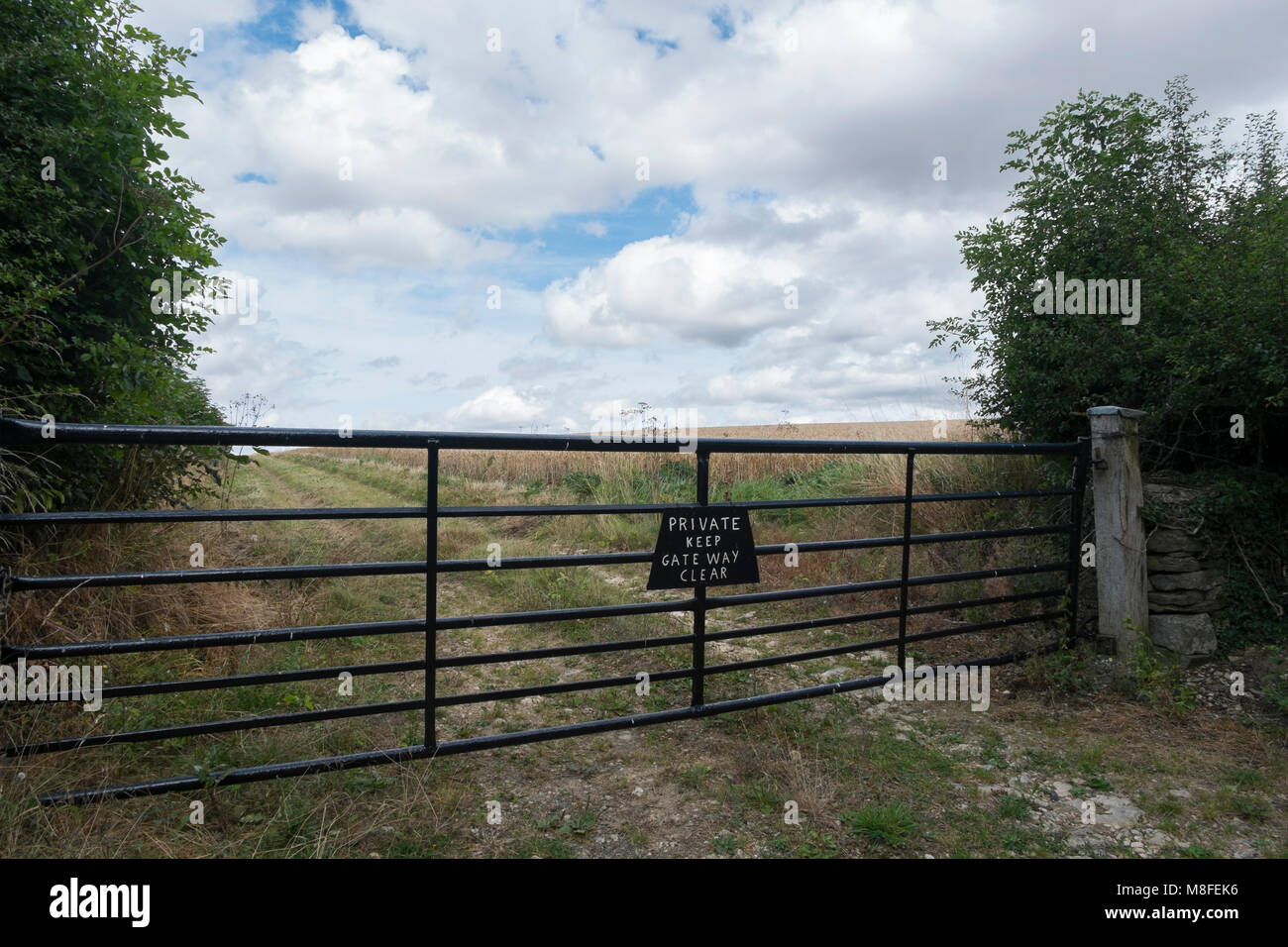 Private Keep Gateway Clear sign on a farm gate leading to a field of ...