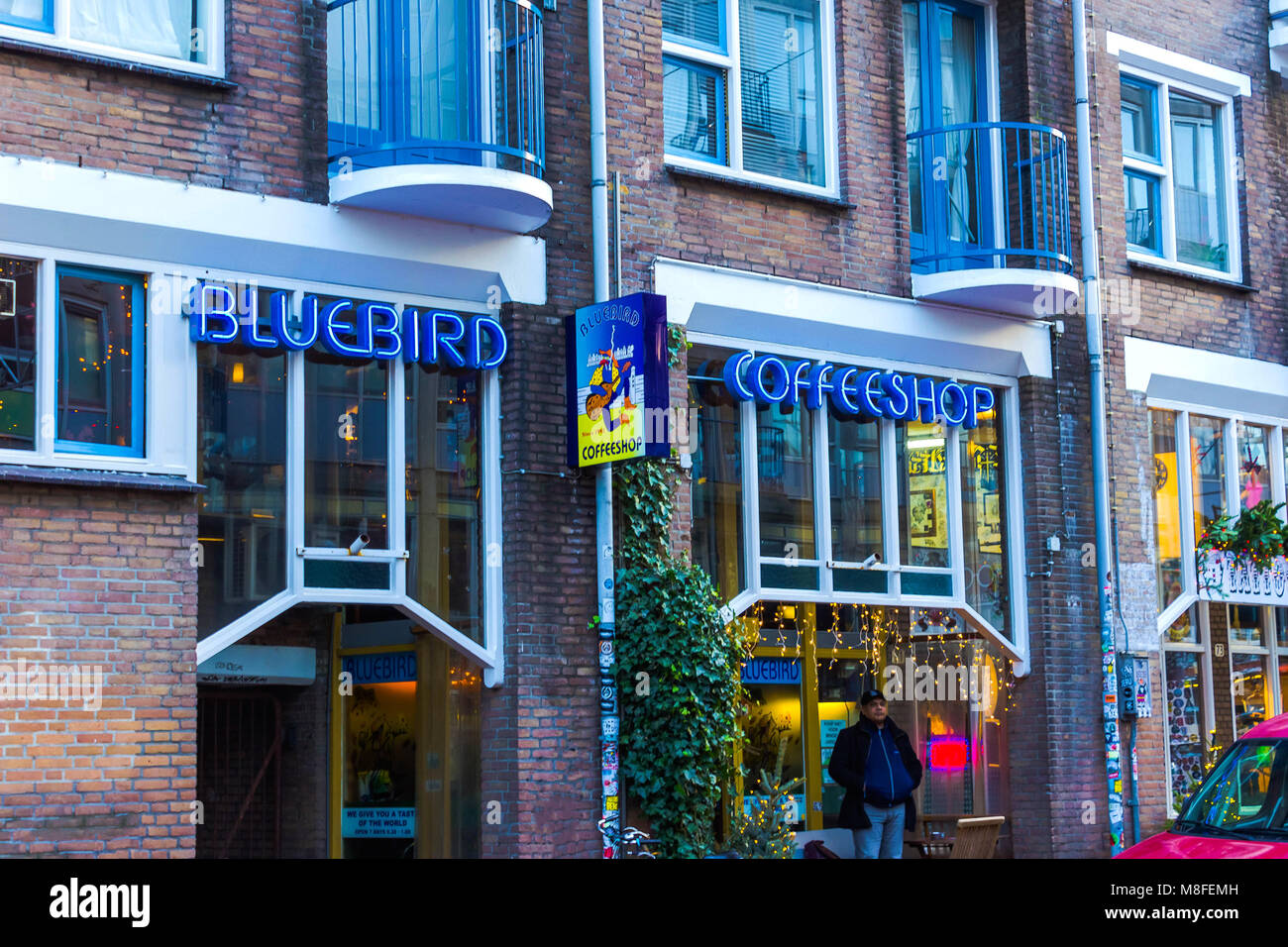 Amsterdam, Netherlands - December 14, 2017: The blue neon coffee shop ...