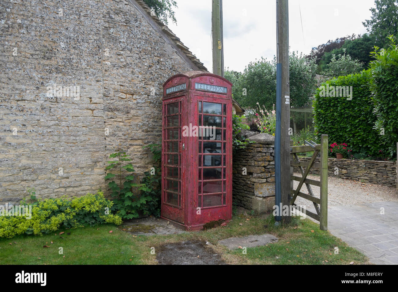 An old, neglected telephone box in Asthall, Oxfordshire, UK Stock Photo ...