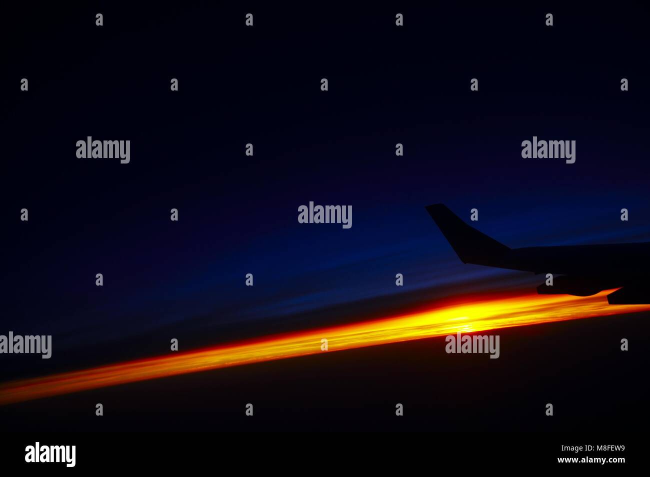 Nice sunrise view from airplane Stock Photo - Alamy