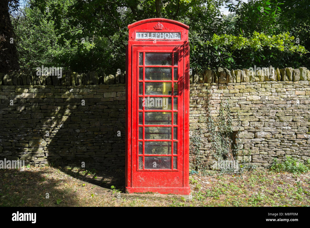 An old, red phone box repurposed with a defibrillator inside at ...