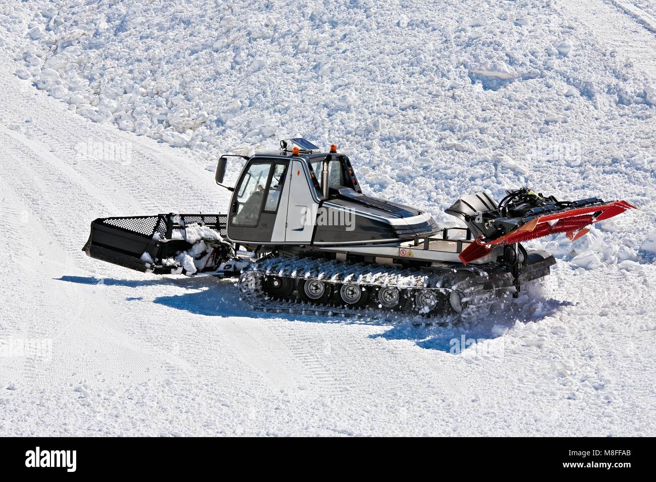 tractor for snow preparation Stock Photo - Alamy