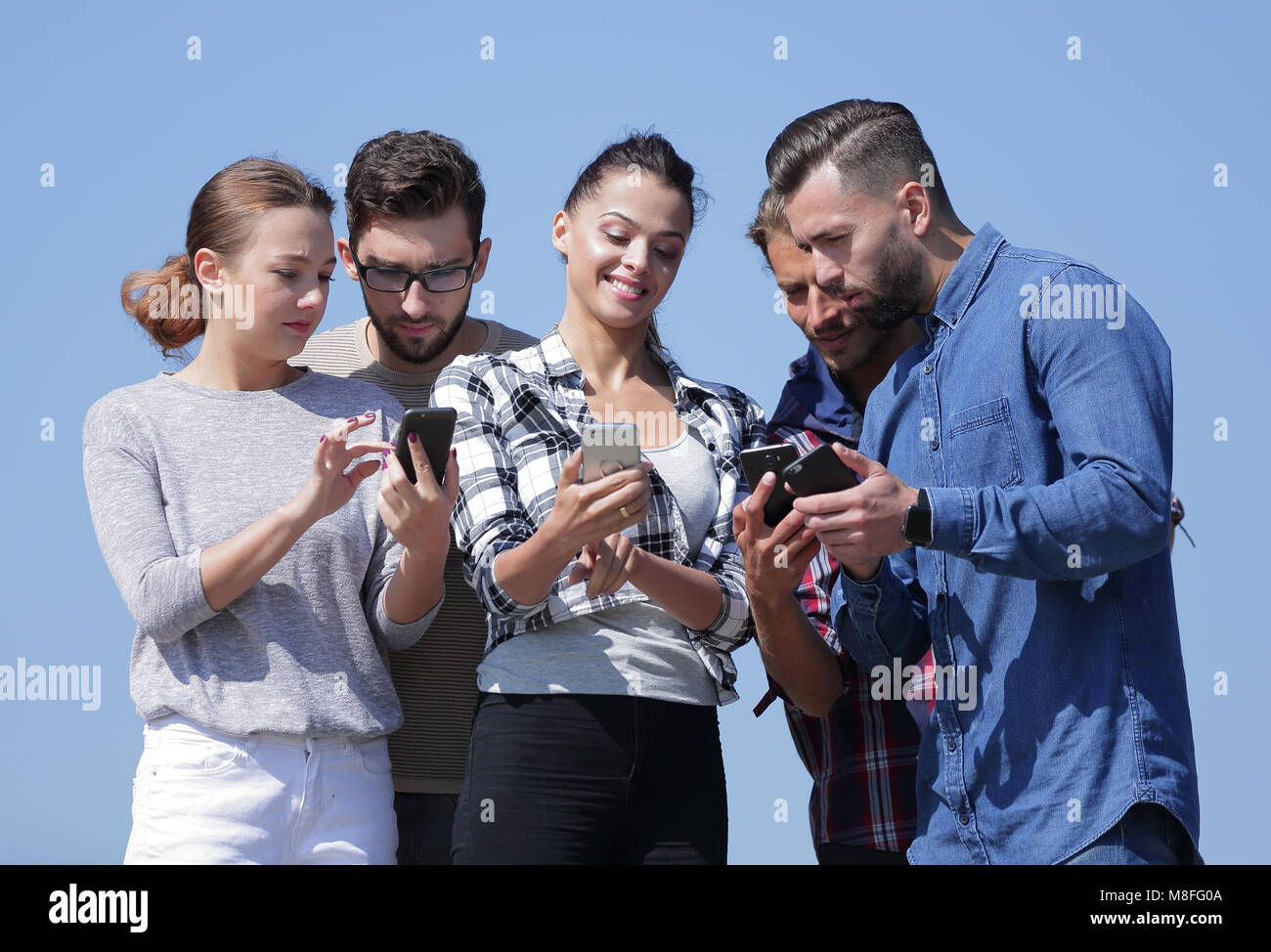 group of young people using smartphones Stock Photo - Alamy