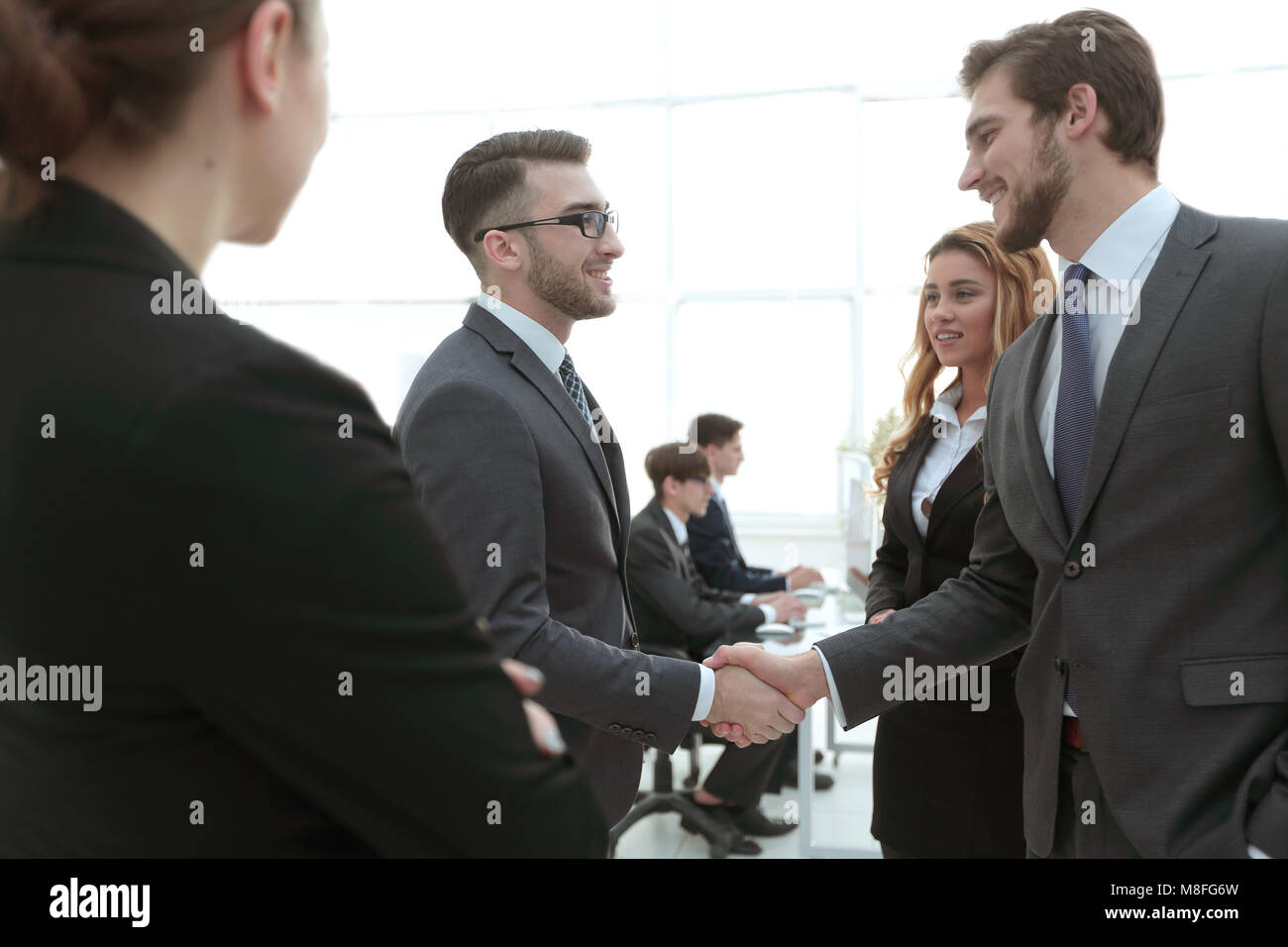 handshake business partners in the office Stock Photo - Alamy
