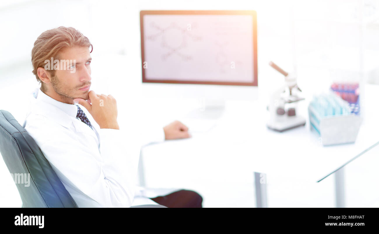 Scientist using computer and microscope in the laboratory Stock Photo ...