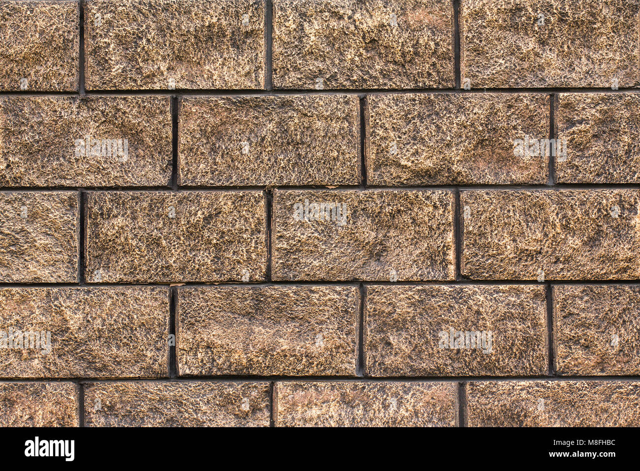 Stone wall of the rectangular bricks - close up Stock Photo - Alamy