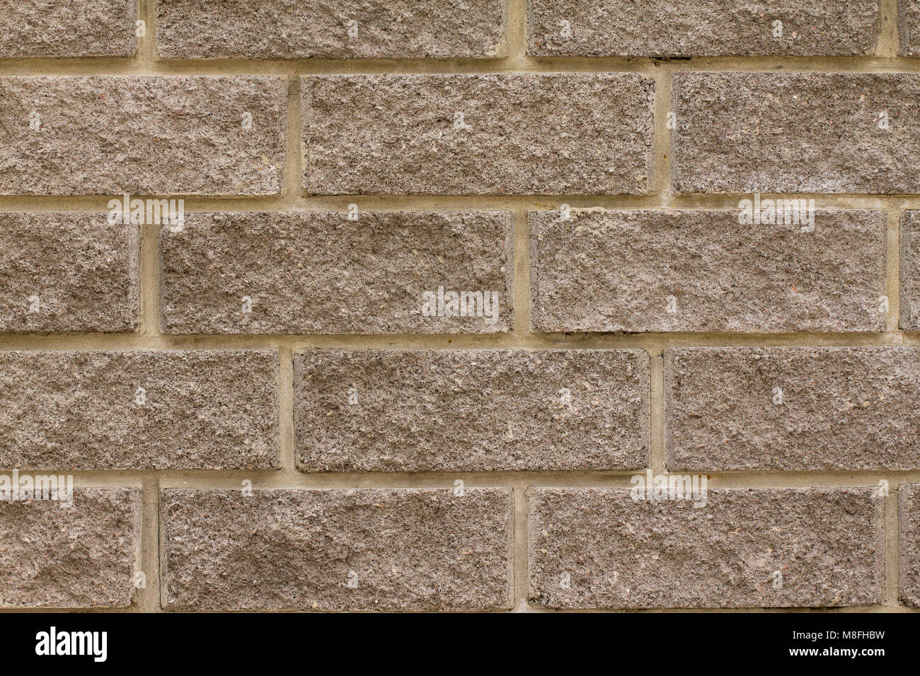 Stone wall of the rectangular bricks - close up Stock Photo - Alamy