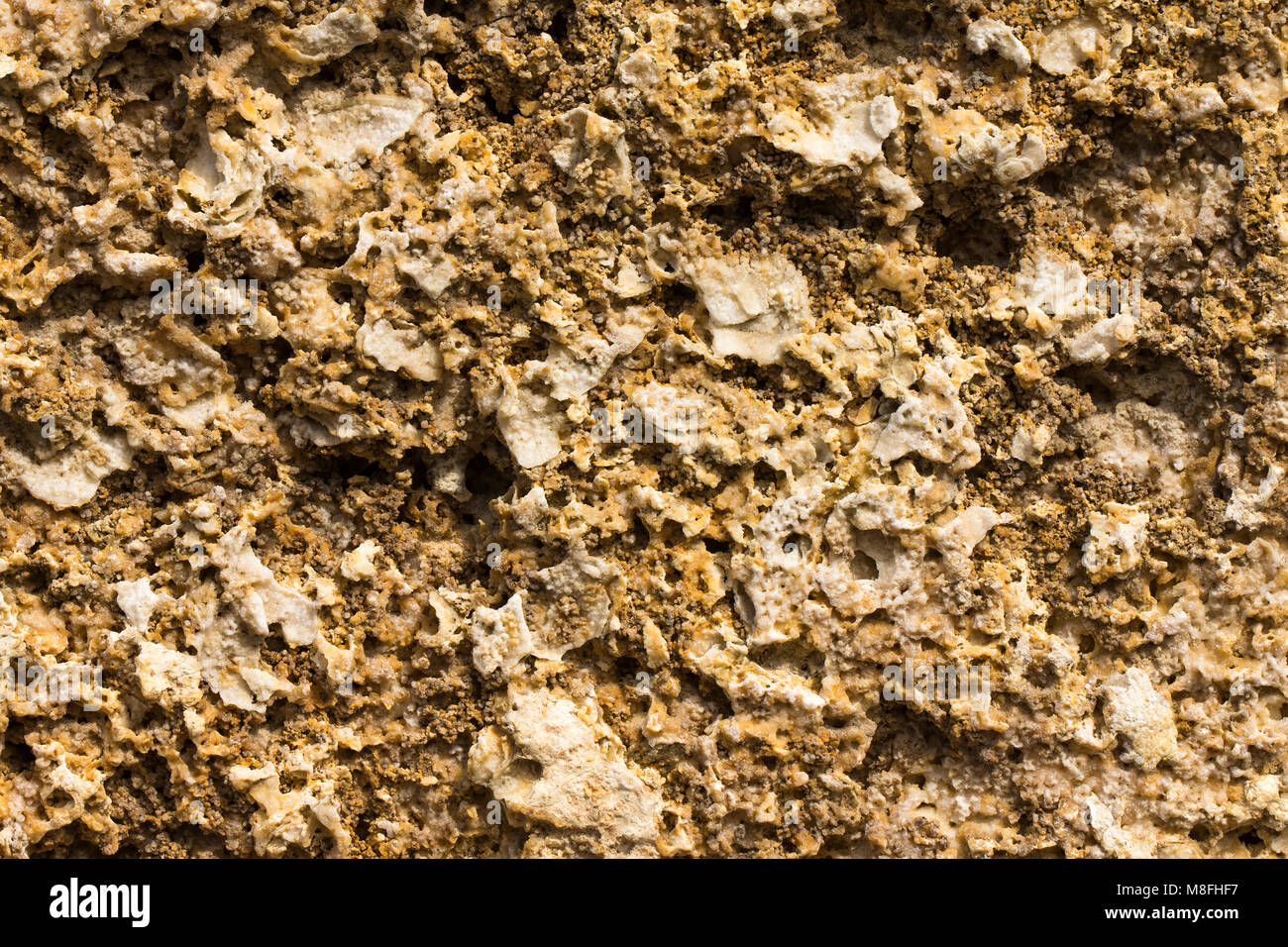 The texture of the stone wall of the porous surface, horizontal shot ...