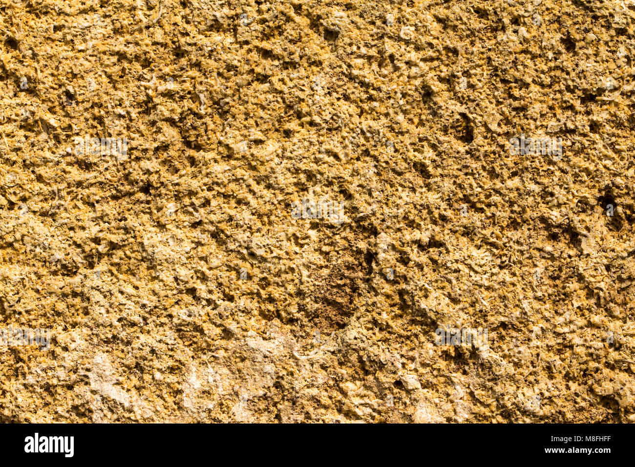 The texture of the stone wall of the porous surface, horizontal shot ...