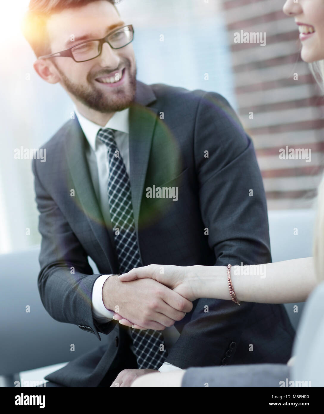 Confident woman shakes hands hi-res stock photography and images - Alamy