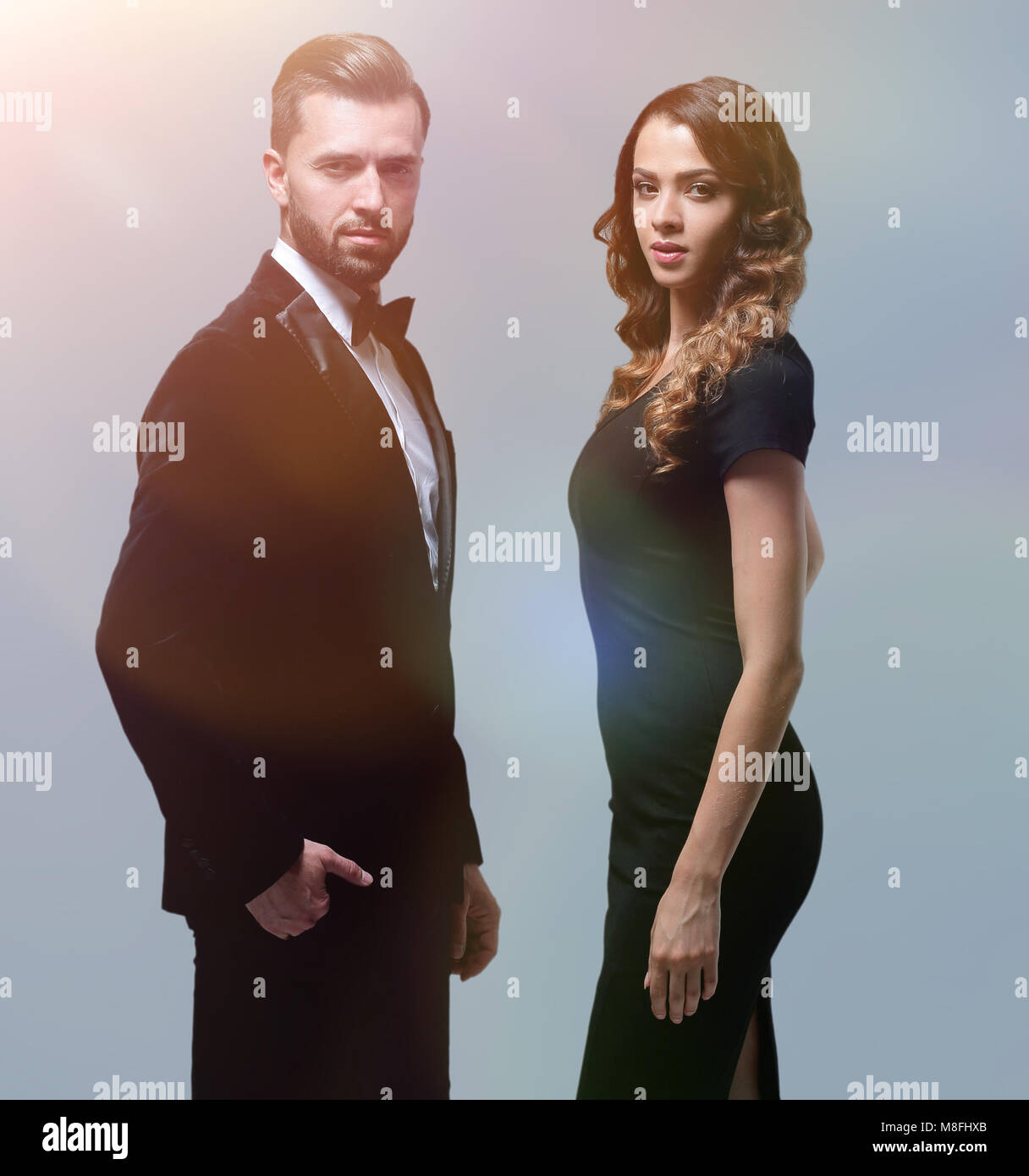 Business partners standing on a gray background Stock Photo - Alamy