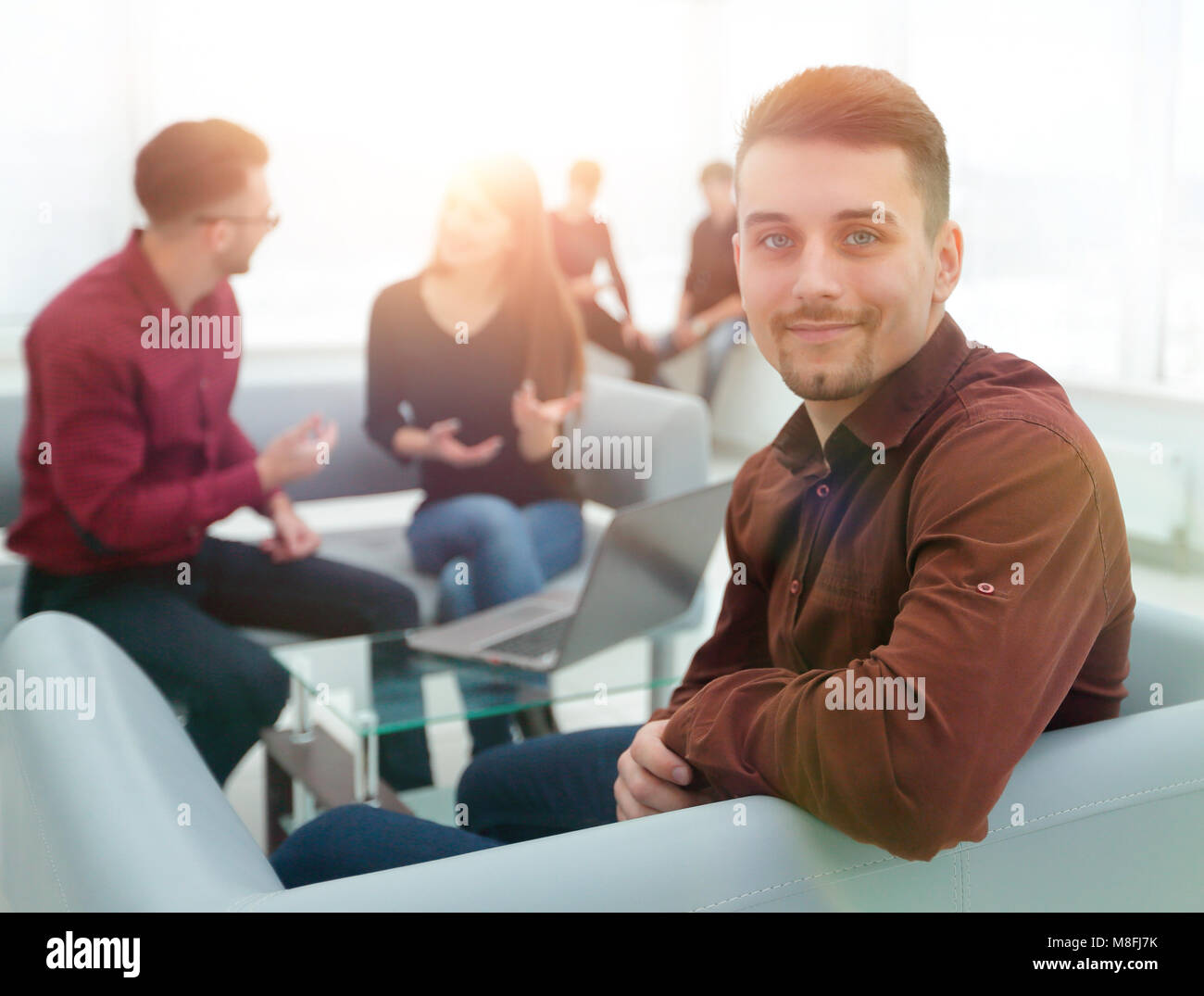 employee on the background of business team Stock Photo - Alamy