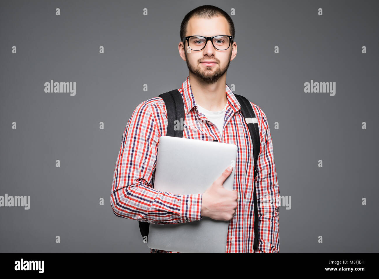 Teen boy carrying books hi-res stock photography and images - Alamy