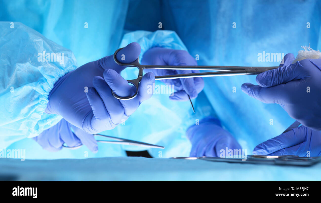 Surgeons Hands And Scissors High Resolution Stock Photography and ...