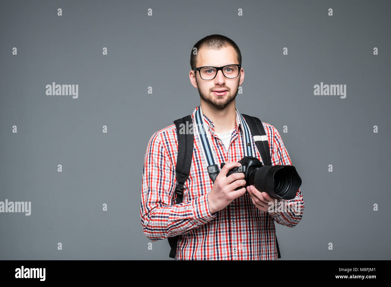 professional male photographer with digital photo camera in photo ...