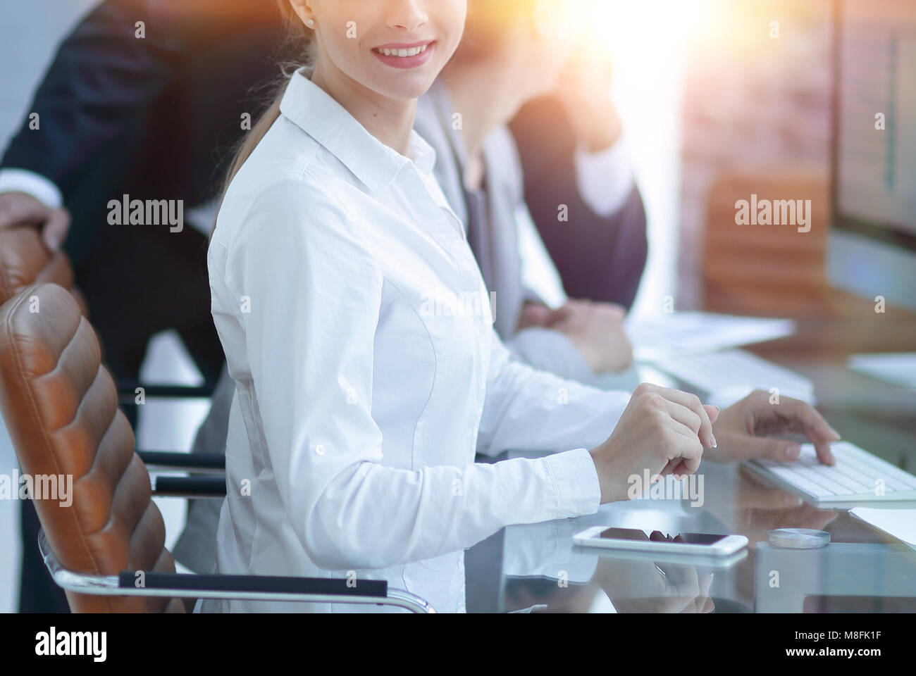 young employee sitting at a Desk Stock Photo - Alamy